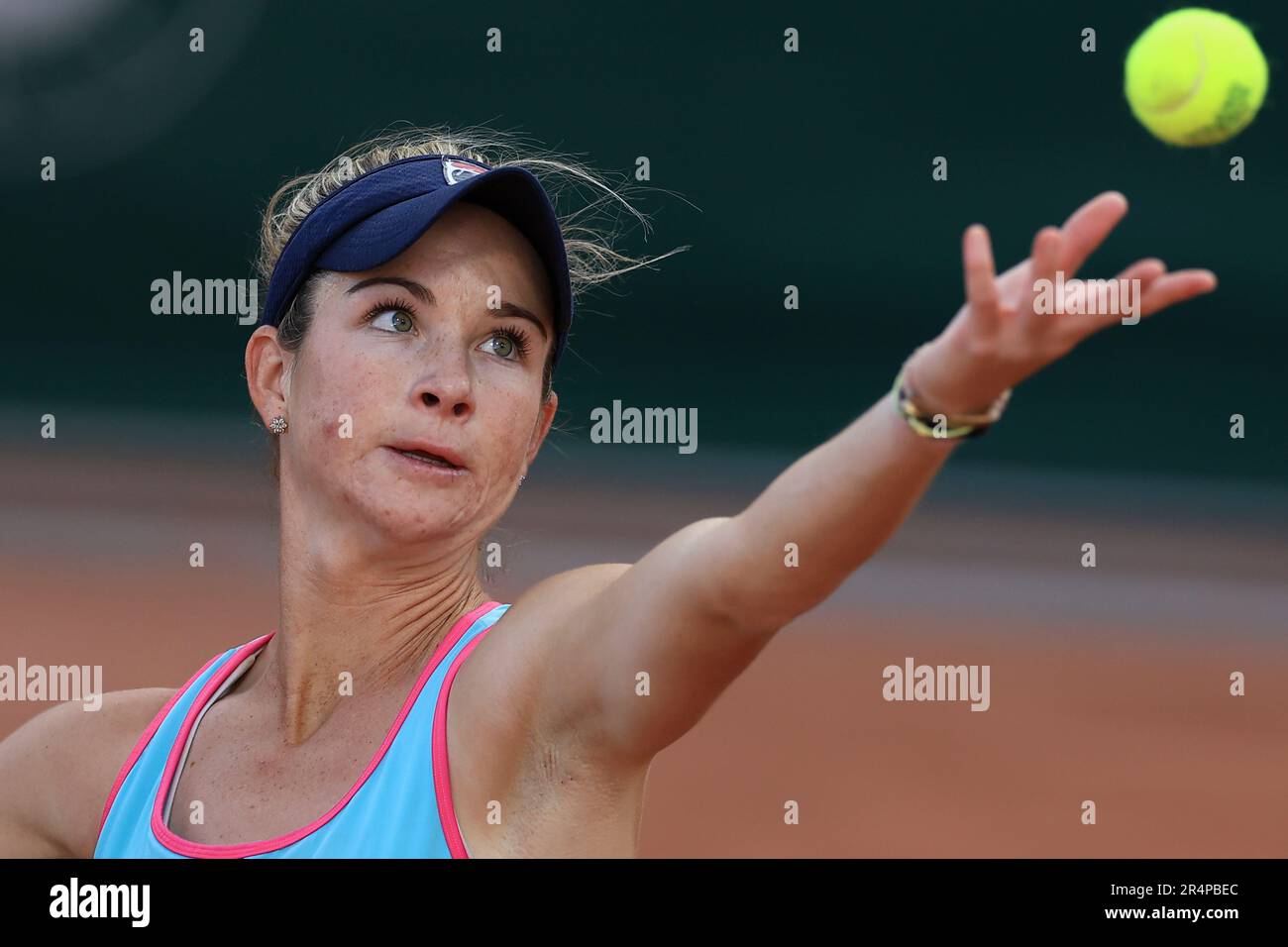 Elizabeth Mandlik of the U.S. serves against Switzerland's Simona ...