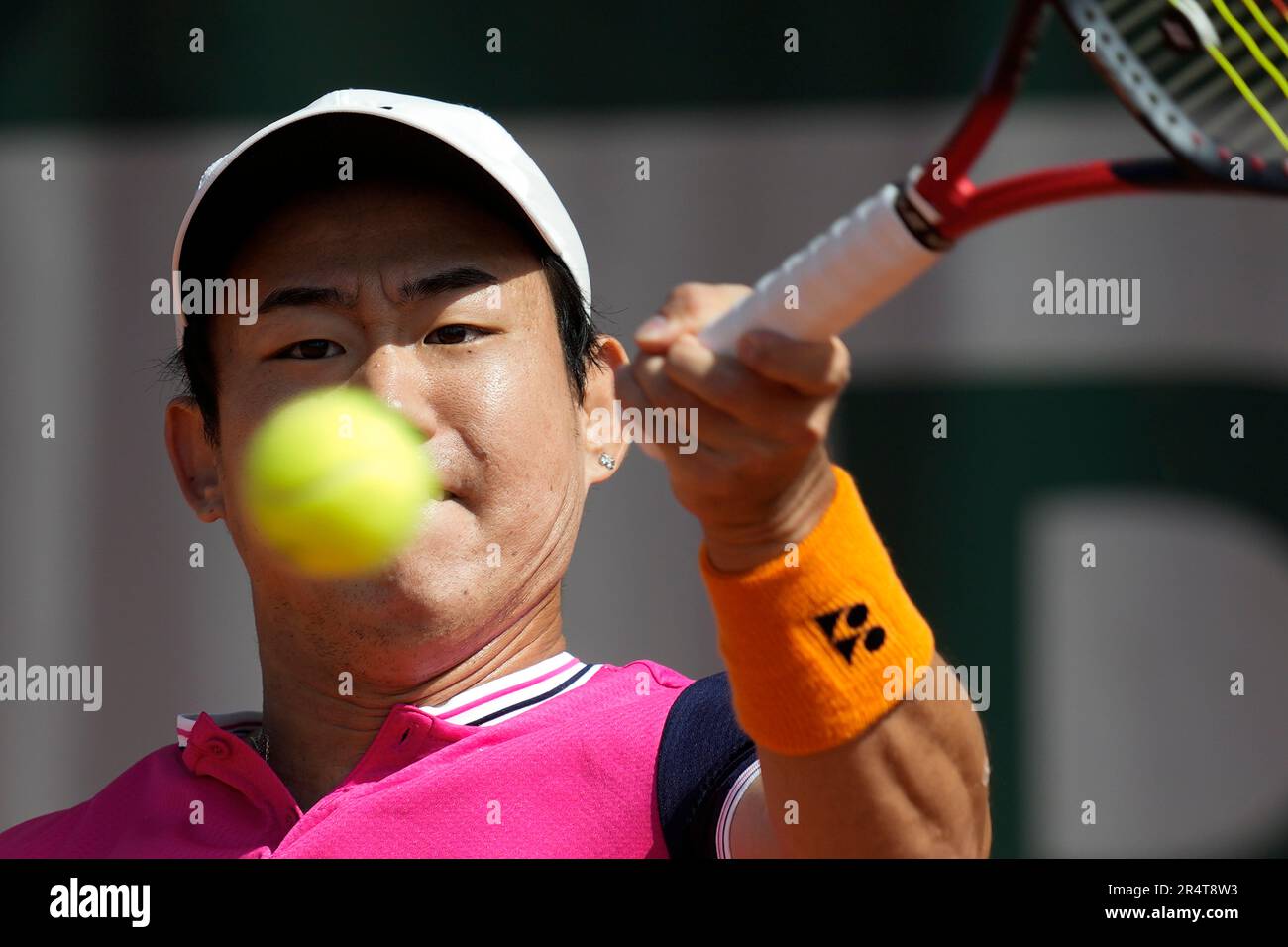 Japan's Yoshihito Nishioka plays a shot against JeffreyJohn Wolf of the U.S. during their first ...