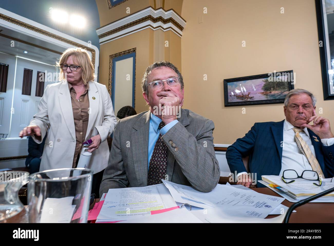 Rep. Thomas Massie, R-Ky., center, flanked by Rep. Michelle Fischbach ...