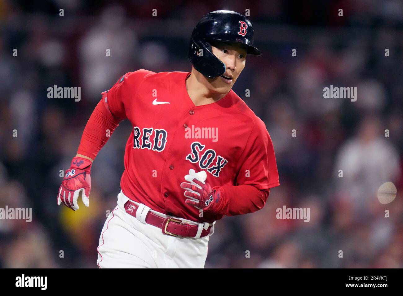 Boston Red Sox's Masataka Yoshida heads down the first base line on his single during the sixth ...