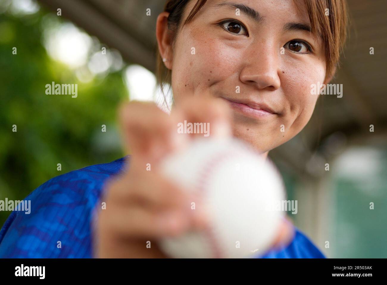 Eri Yoshida of a Japanese women's baseball team, Agekke, shows her knuckleball grip during an ...