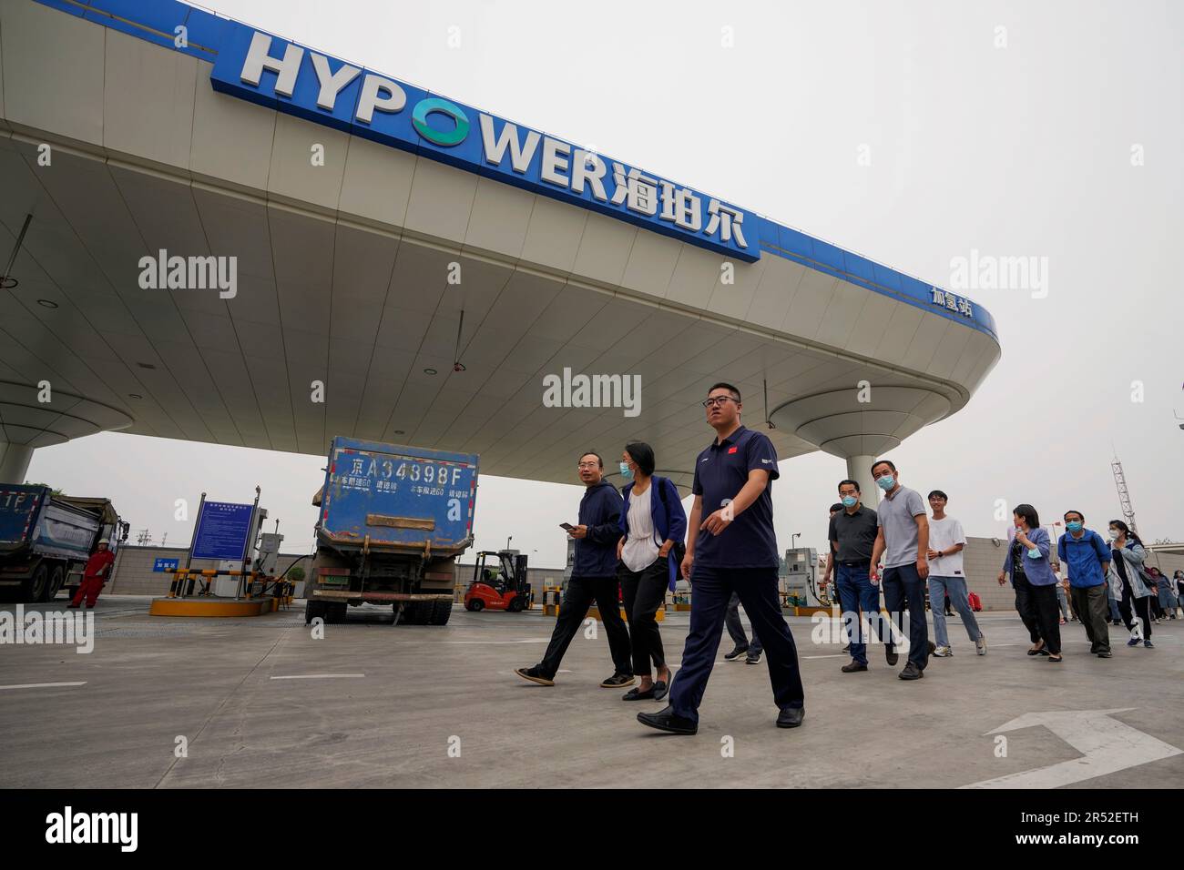 Visitors walk by a hydrogen refueling station during an organized media ...