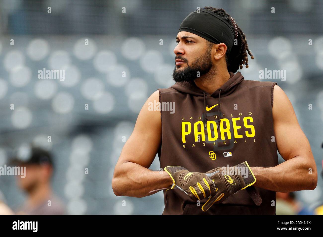 San Diego Padres' Fernando Tatis Jr. adjusts his batting gloves during batting practice prior to ...