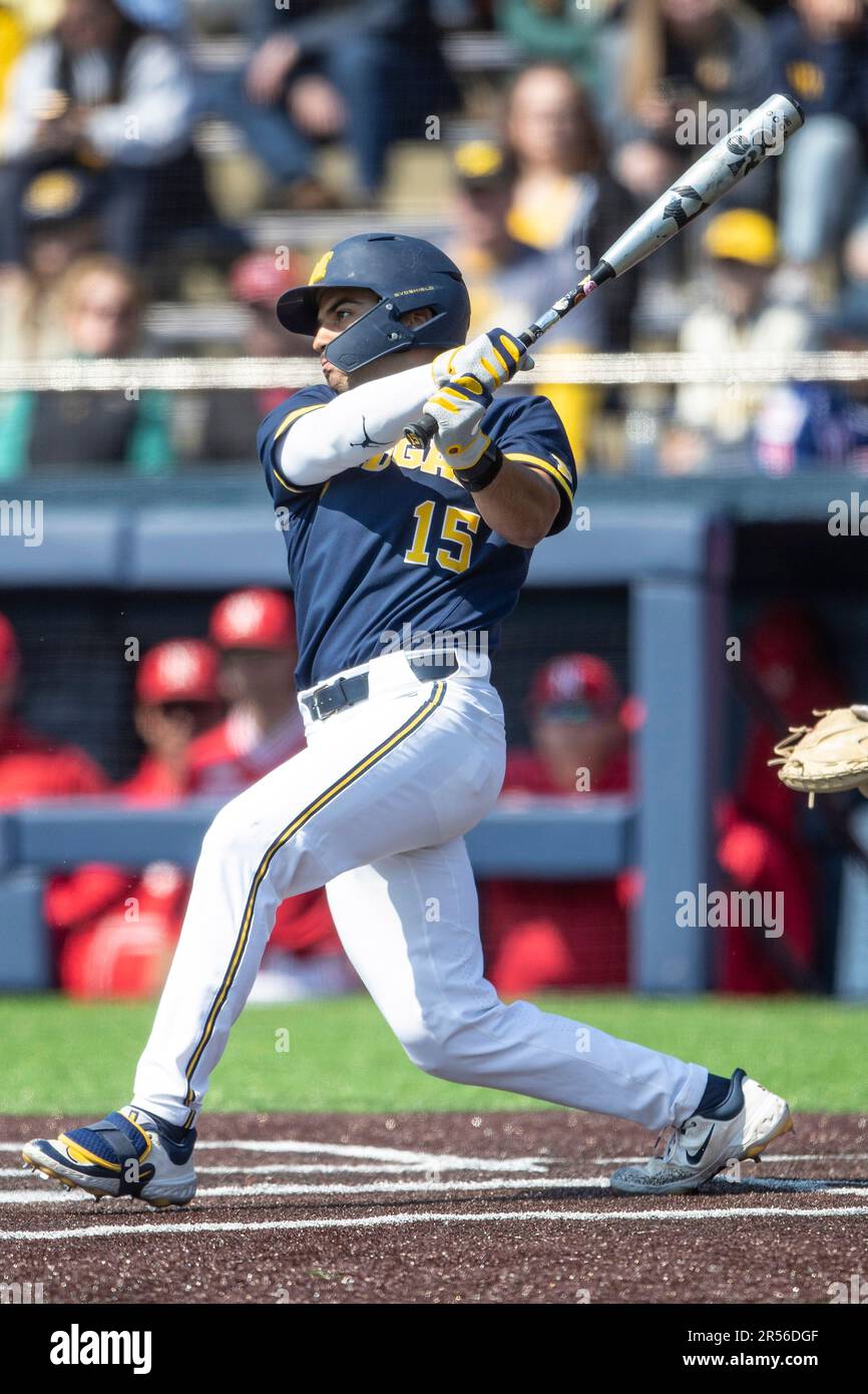 Michigan Wolverines catcher Gabe Sotres (15) follows through on his ...