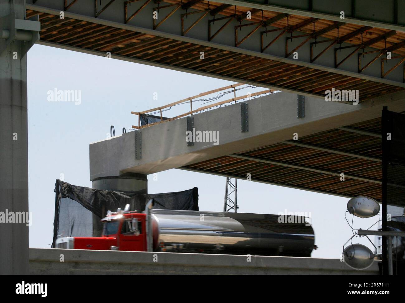 A gas tanker truck travelling on I-880 drives below the narrowing the ...