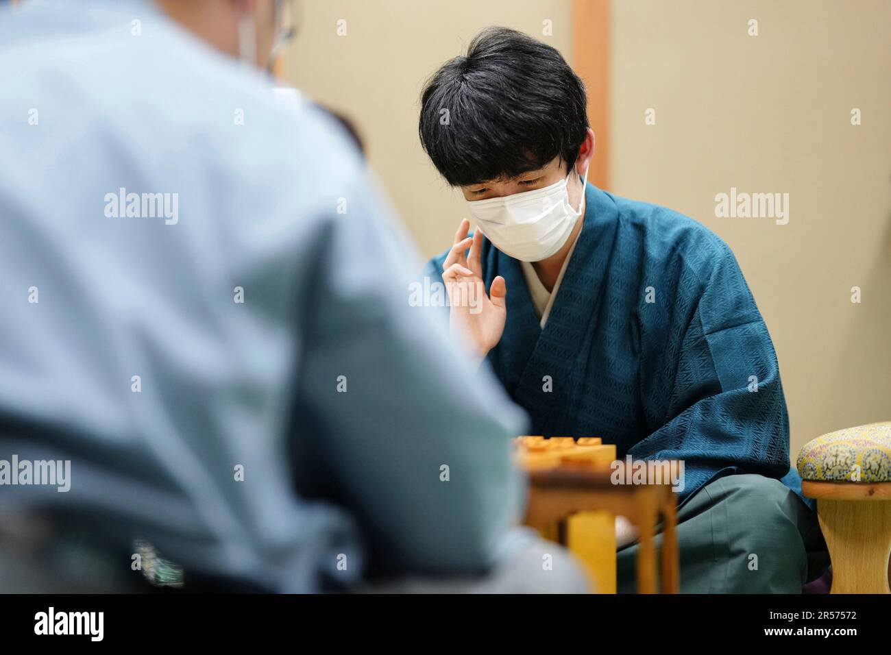 Shogi player Sota Fujii (R) reviews the Meijin title against Akira ...