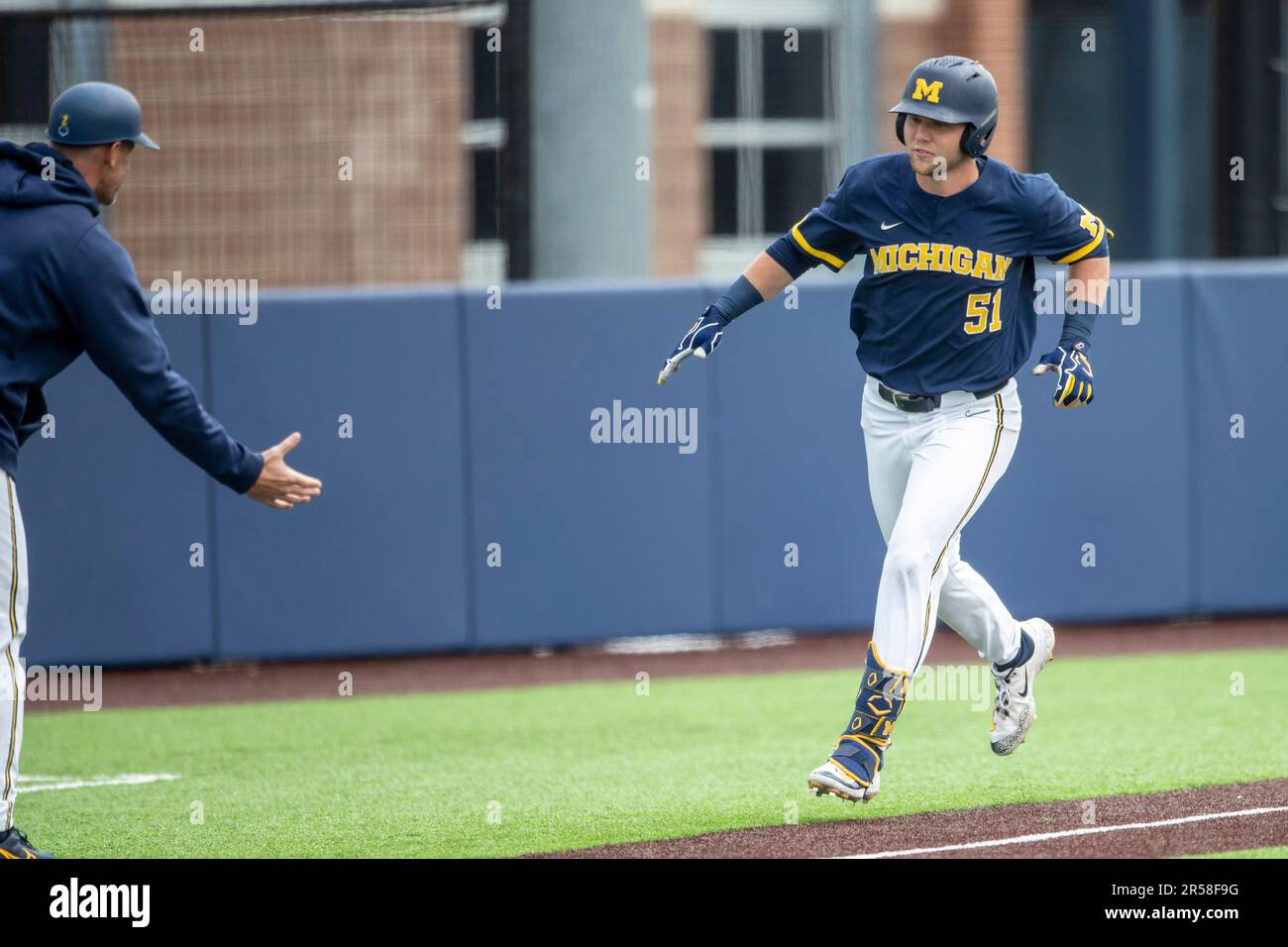 Michigan Wolverines first baseman Jack Van Remortel (51) jogs around ...