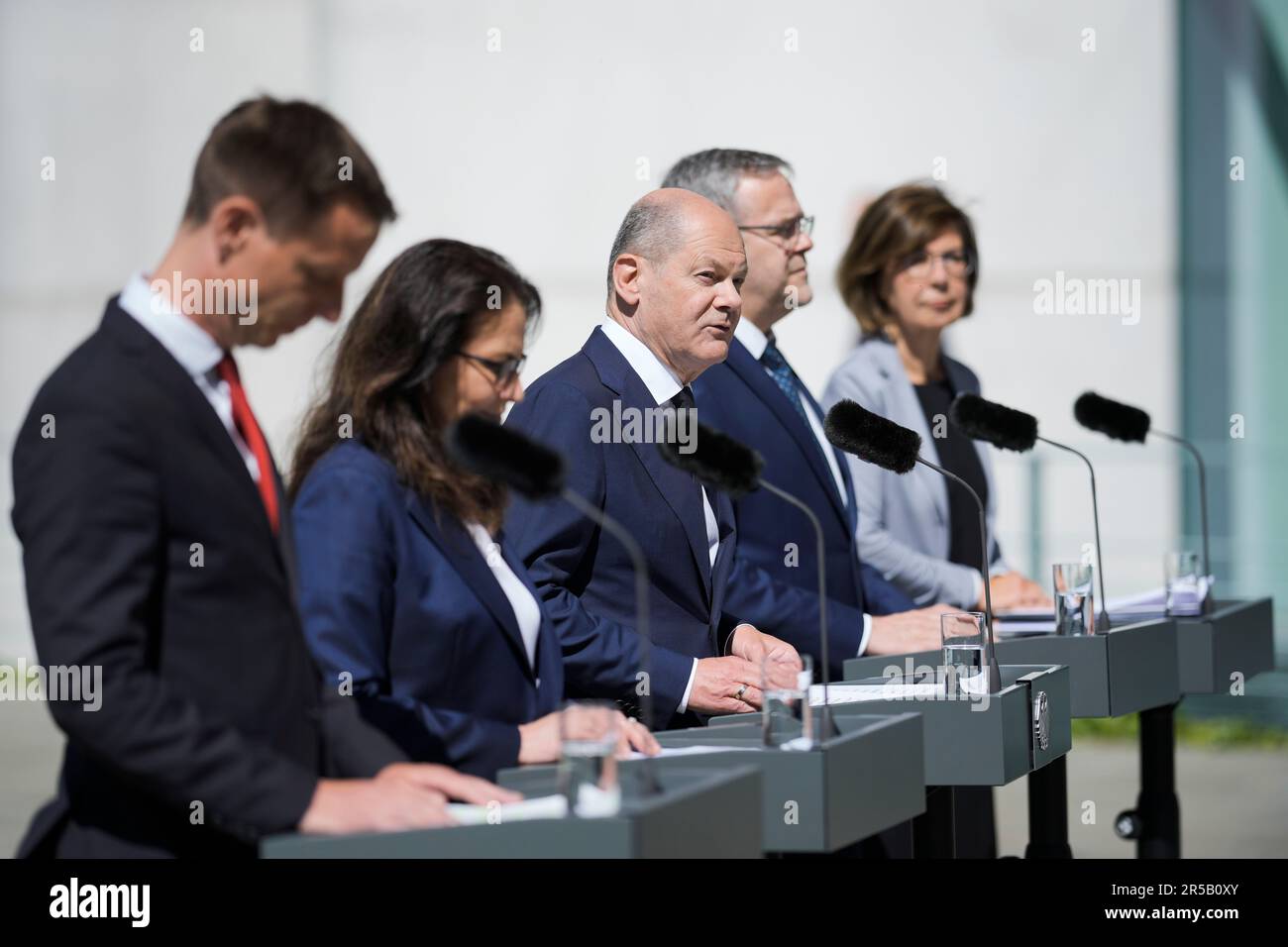 German Chancellor Olaf Scholz, center, attends a news conference with ...