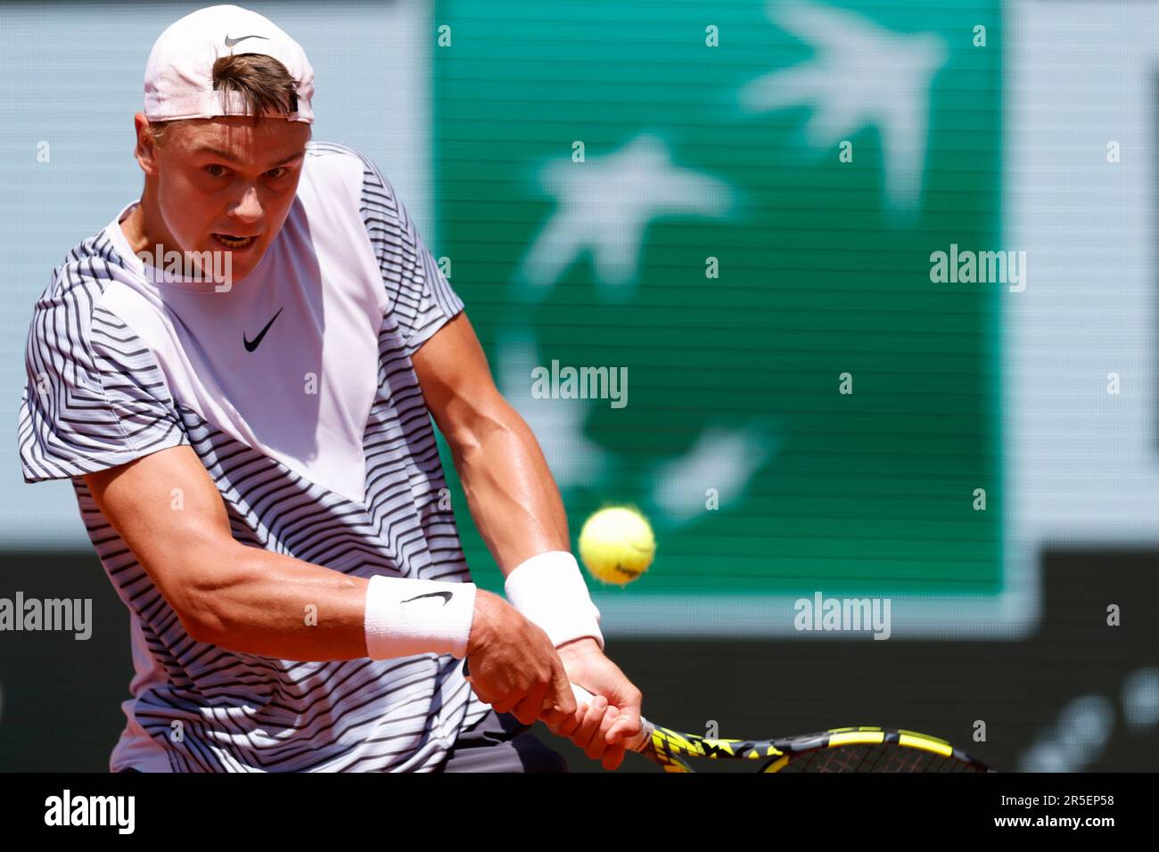 Denmark's Holger Rune plays a shot against Argentina's Genaro Alberto ...