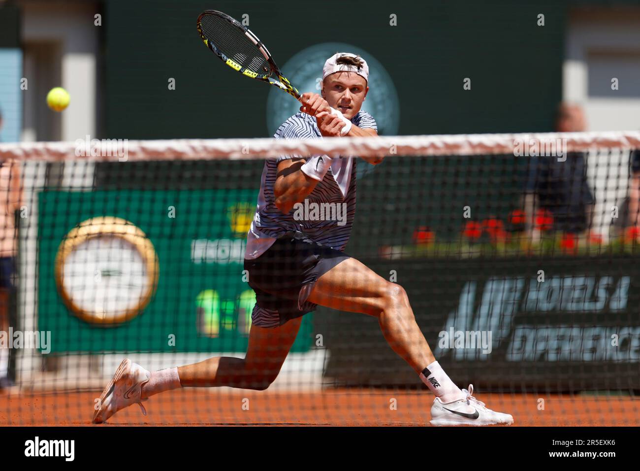 Denmark's Holger Rune plays a shot against Argentina's Genaro Alberto ...