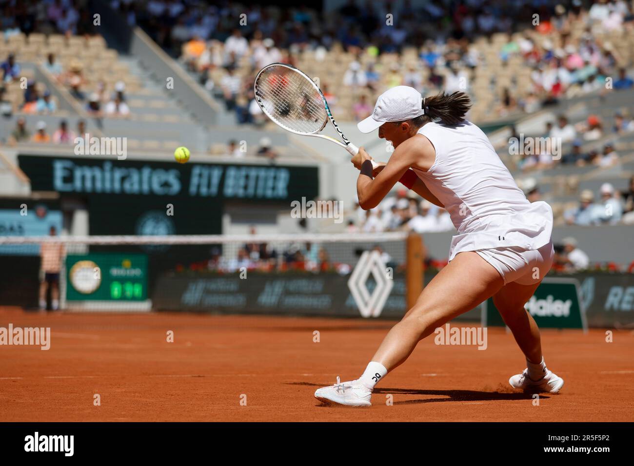 Poland's Iga Swiatek plays a shot against China's Wang Xinyu during ...