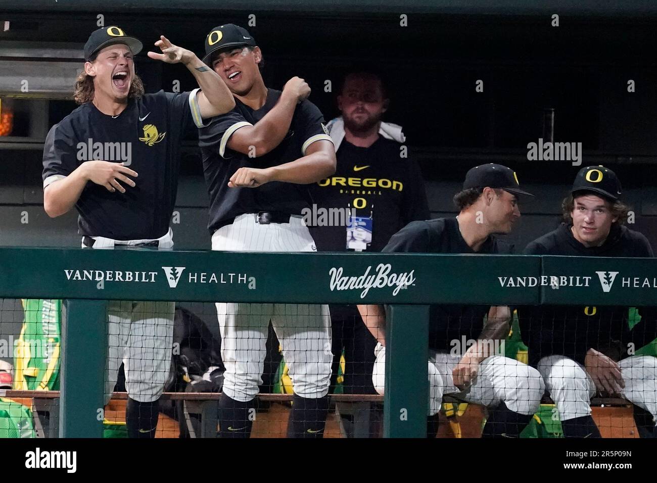 Oregon players celebrate in the dugout as they win 11-2 against Xavier ...