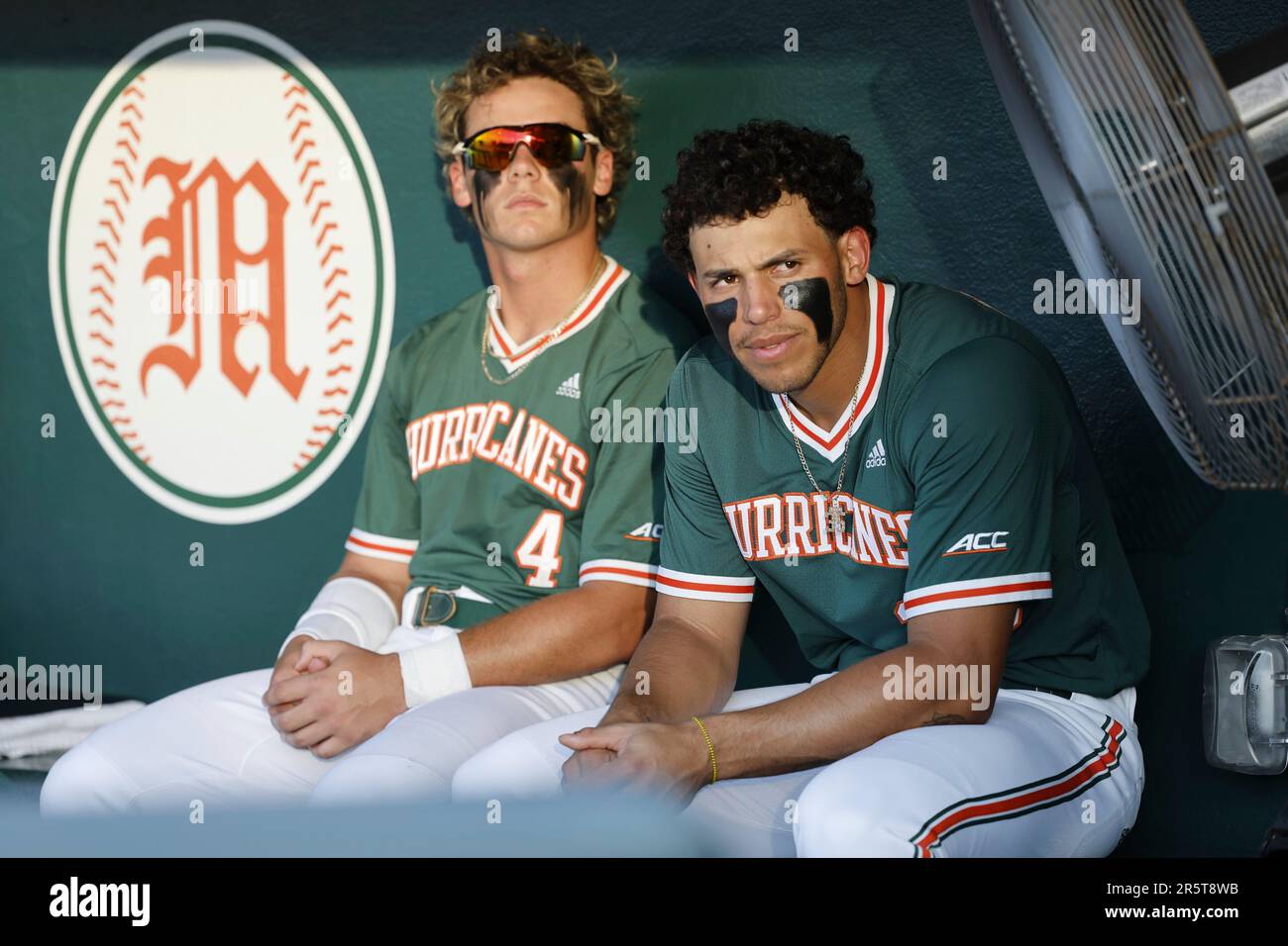 Miami Hurricanes infielder Blake Cyr (4) and outfielder Edgardo ...