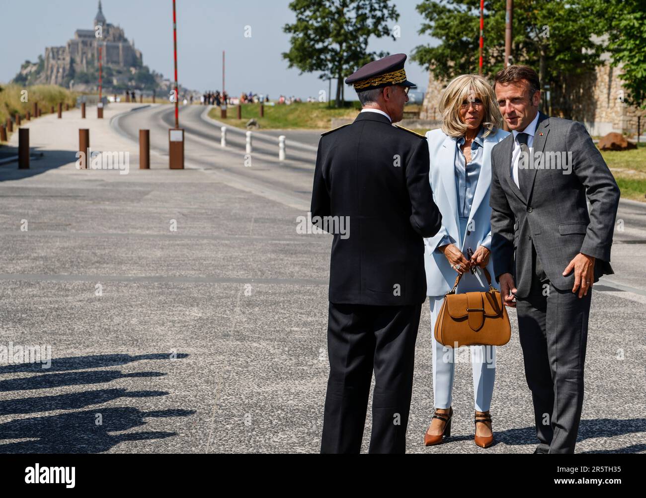 France's President Emmanuel Macron, right, and his wife Brigitte Macron ...