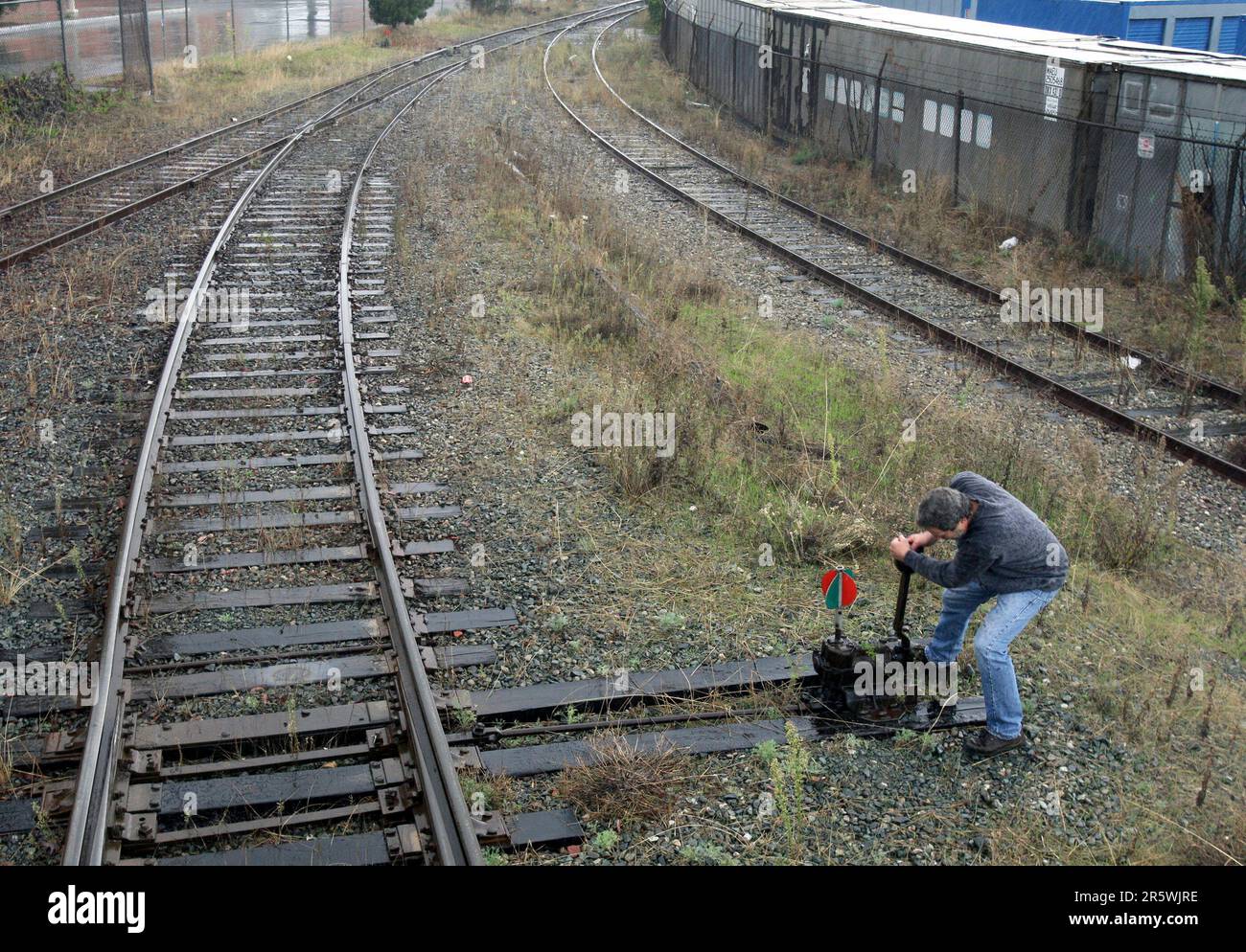 Train engineer Bob Grady manually switches the track at the LB Railco ...
