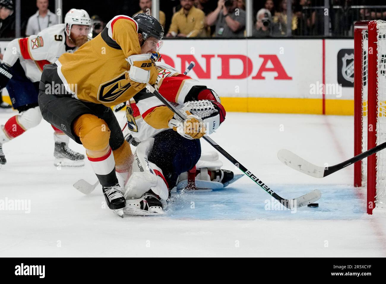 Vegas Golden Knights center Brett Howden, left, scores on Florida ...