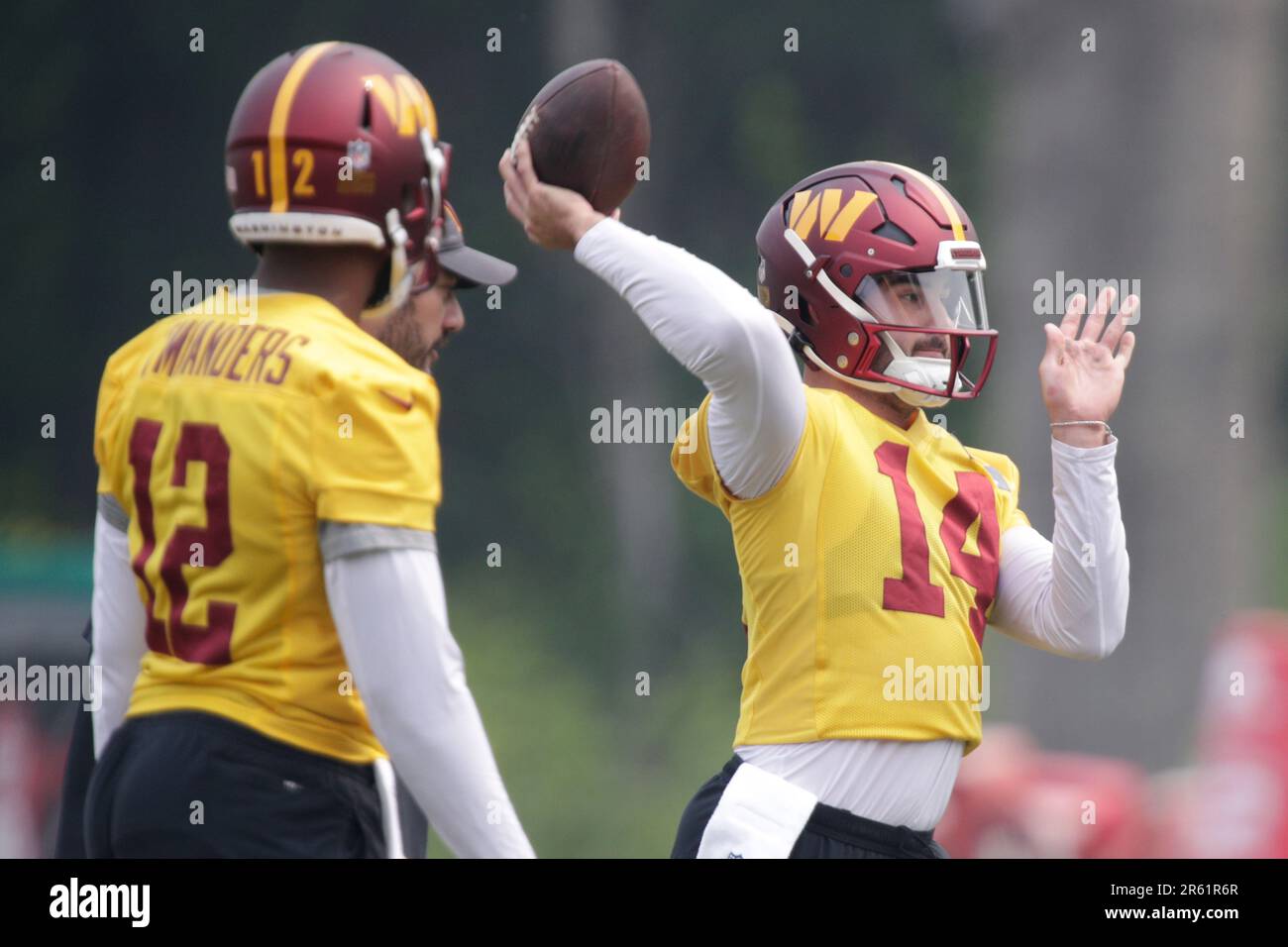 Washington Commanders quarterback Sam Howell (14) throws a pass as ...