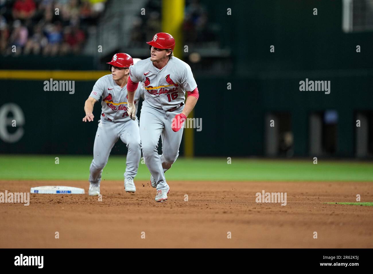 St. Louis Cardinals' Nolan Gorman, front, and Tommy Edman, left, sprint ...