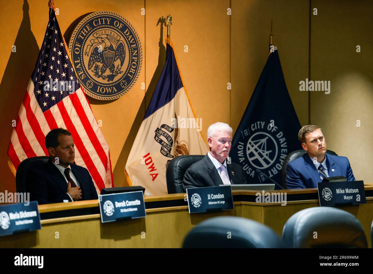 Davenport, Iowa, Mayor Mike Matson, center, listens to public comment ...