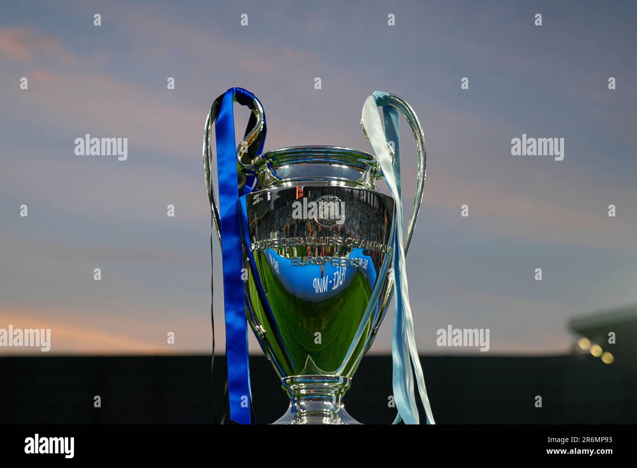 Spectators are reflected in the competition trophy, placed on a stand ...