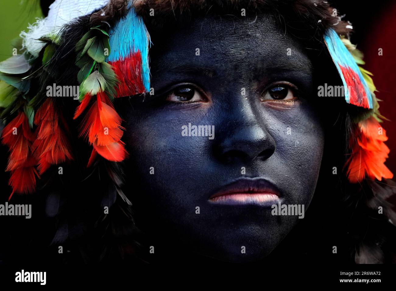 An Indigenous girl prepares to take part in a ritual during the final ...