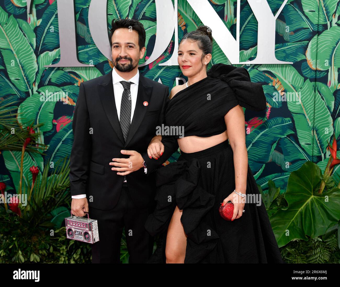 Lin-Manuel Miranda, wearing a pin in support for the WGA strike, left ...