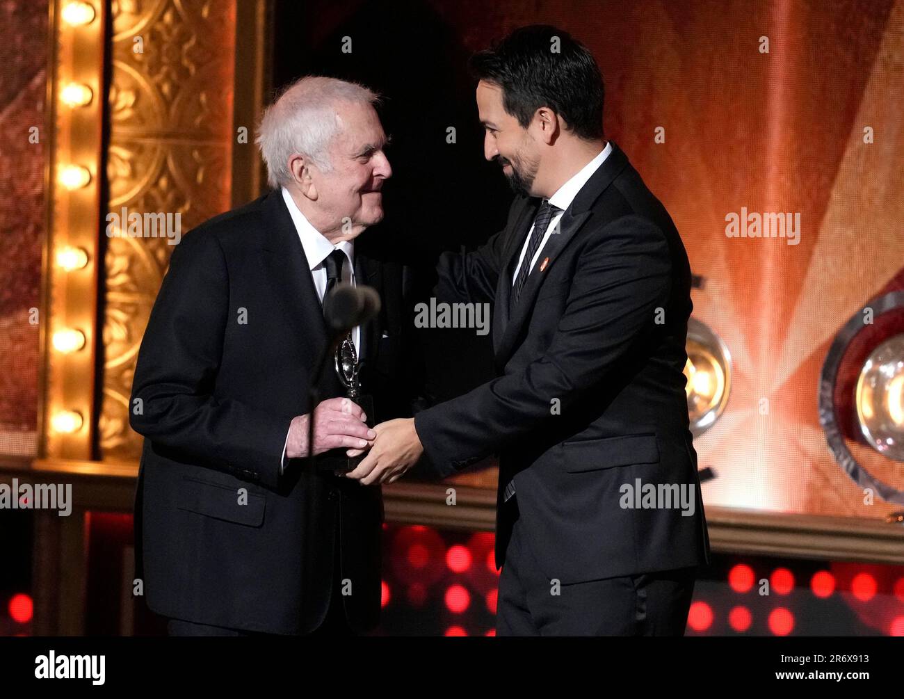 Lin-Manuel Miranda, right, presents the award for lifetime achievement ...