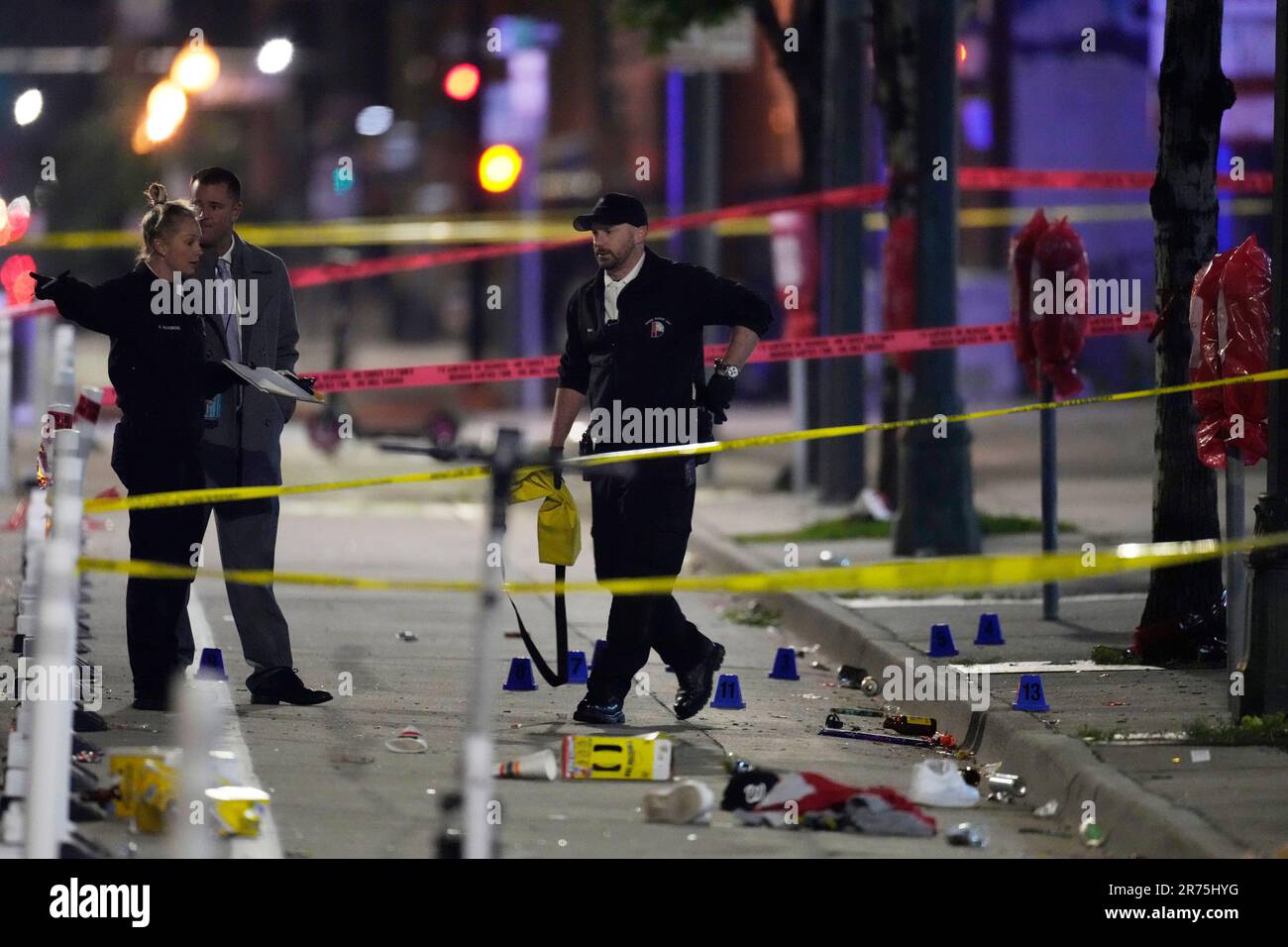 Denver Police Department investigators work the scene of a mass ...
