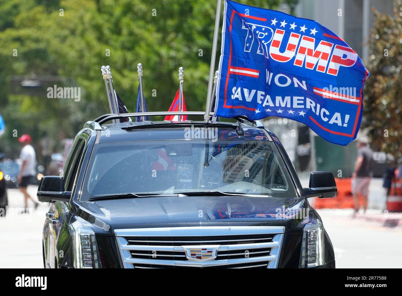 Supporters of former President Donald Trump, drive near the Wilkie D ...