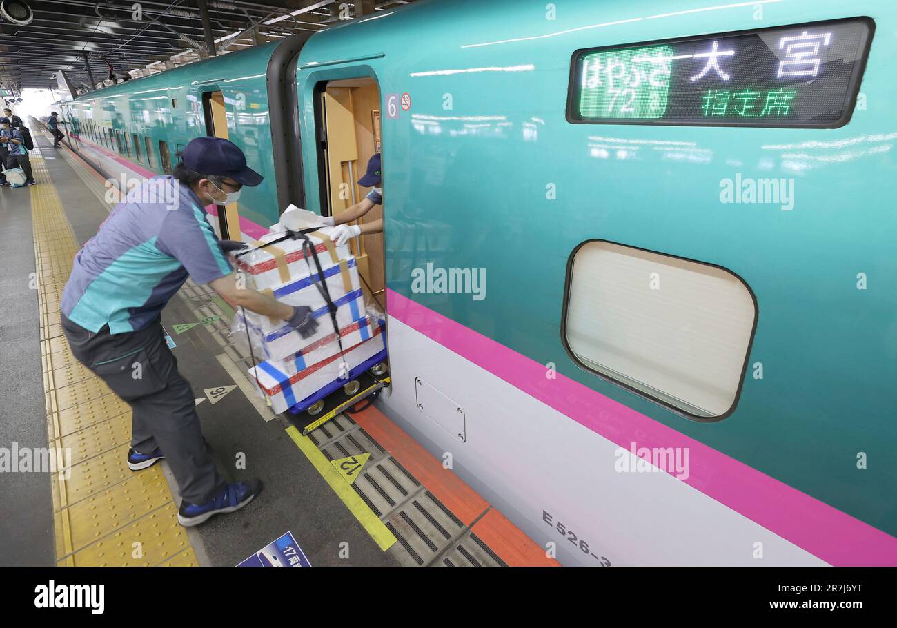 Boxes of fresh foods and others are carried out at Omiya station in ...
