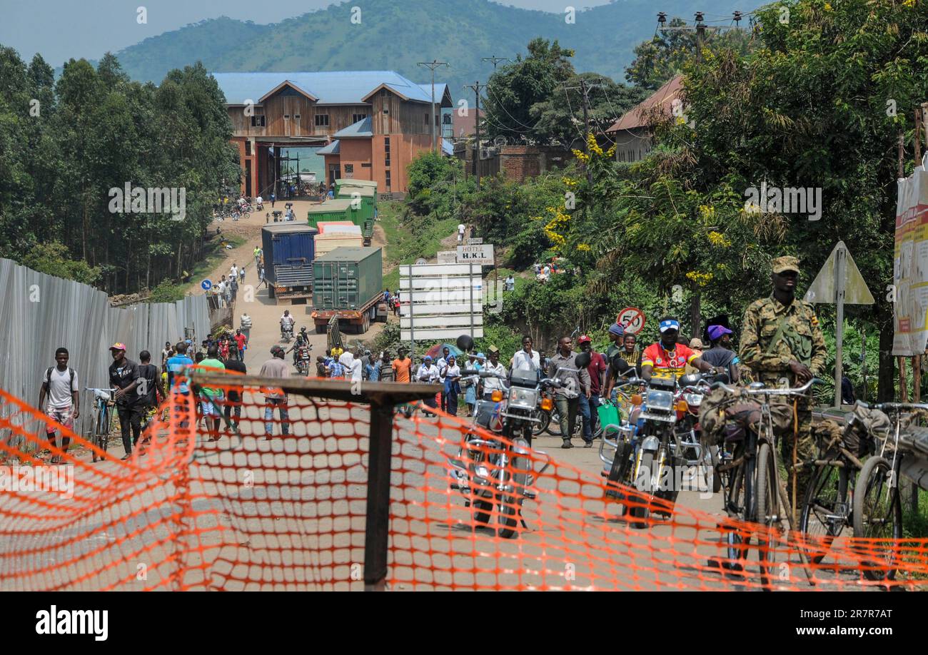 FILE - People pass along the road leading to the Mpondwe border ...