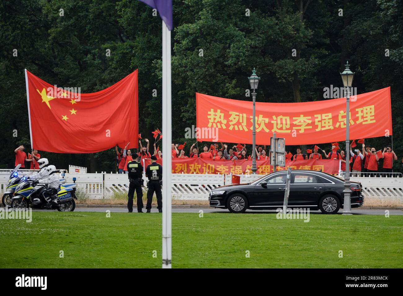 Supporters welcomes Chinese Premier Li Qiang as he arrives for a ...