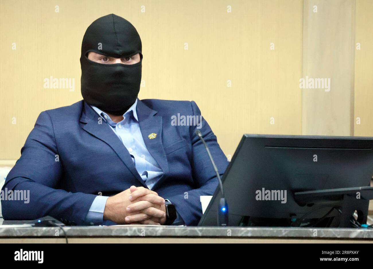 Broward Sheriff's Office Detective Danny Polo, whose face is concealed ...