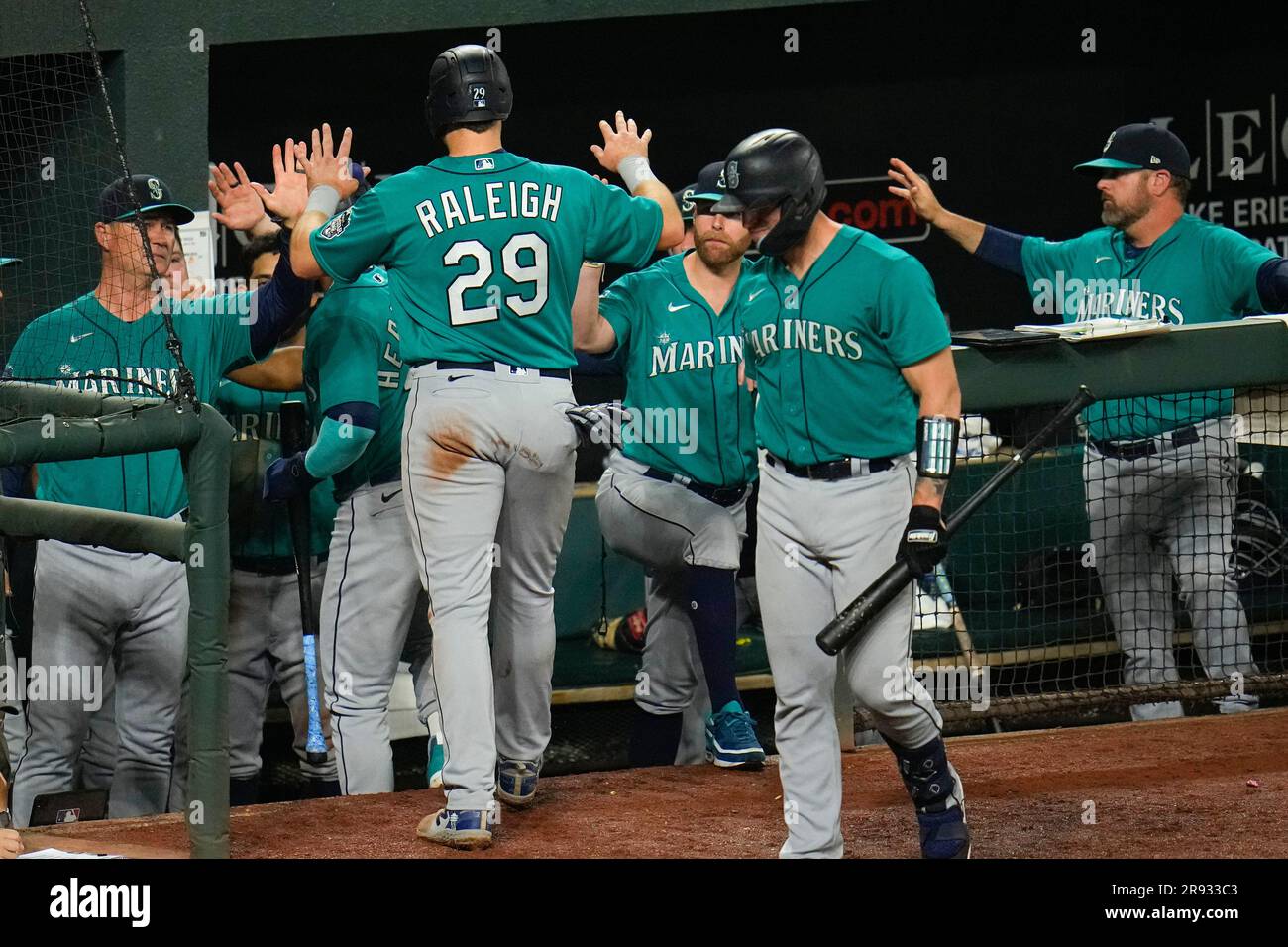 Seattle Mariners' Cal Raleigh (29) is greeted in the dugout after ...