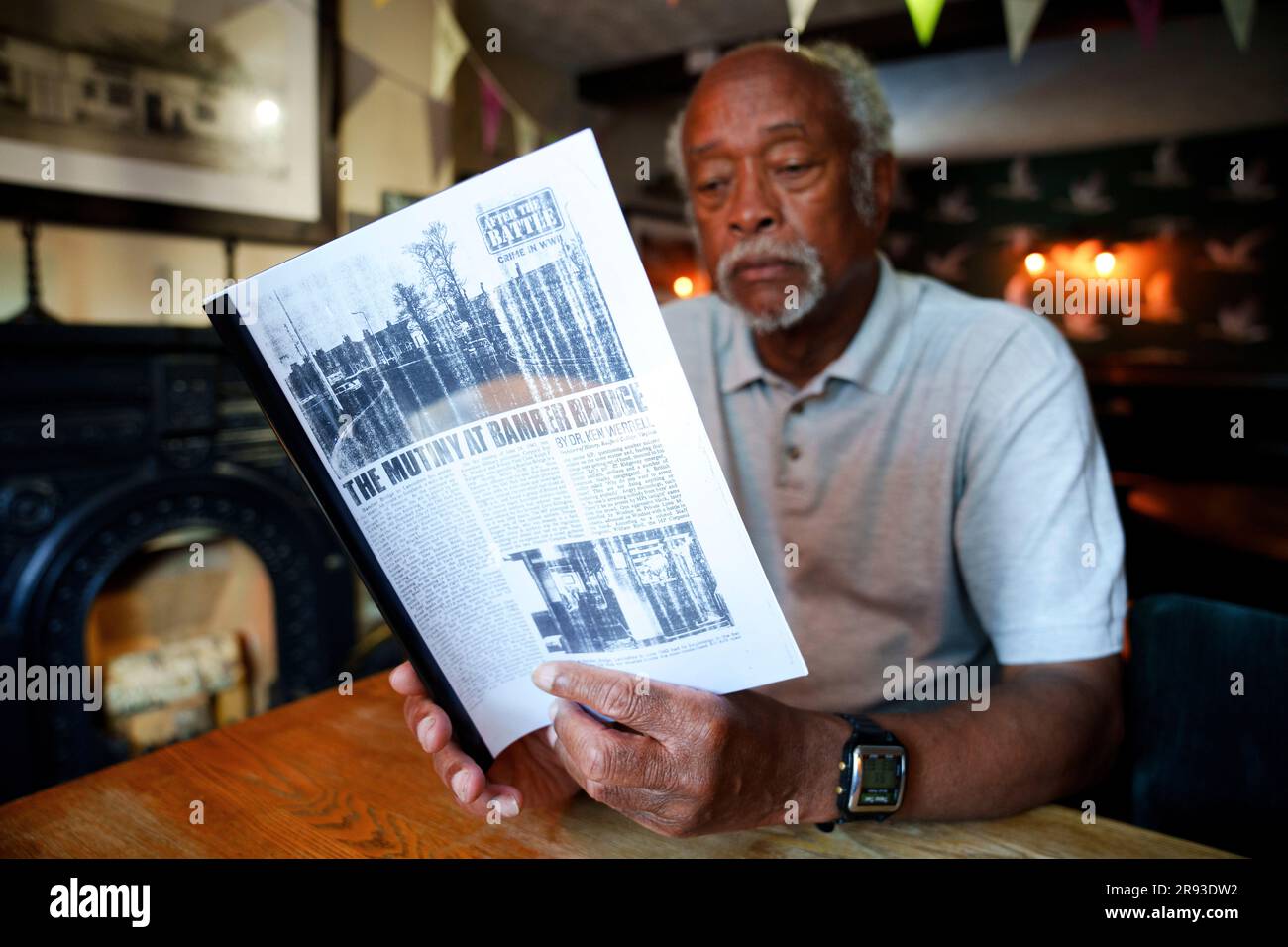 Clinton Smith, chair of Preston Black History Group reads a copy of a ...