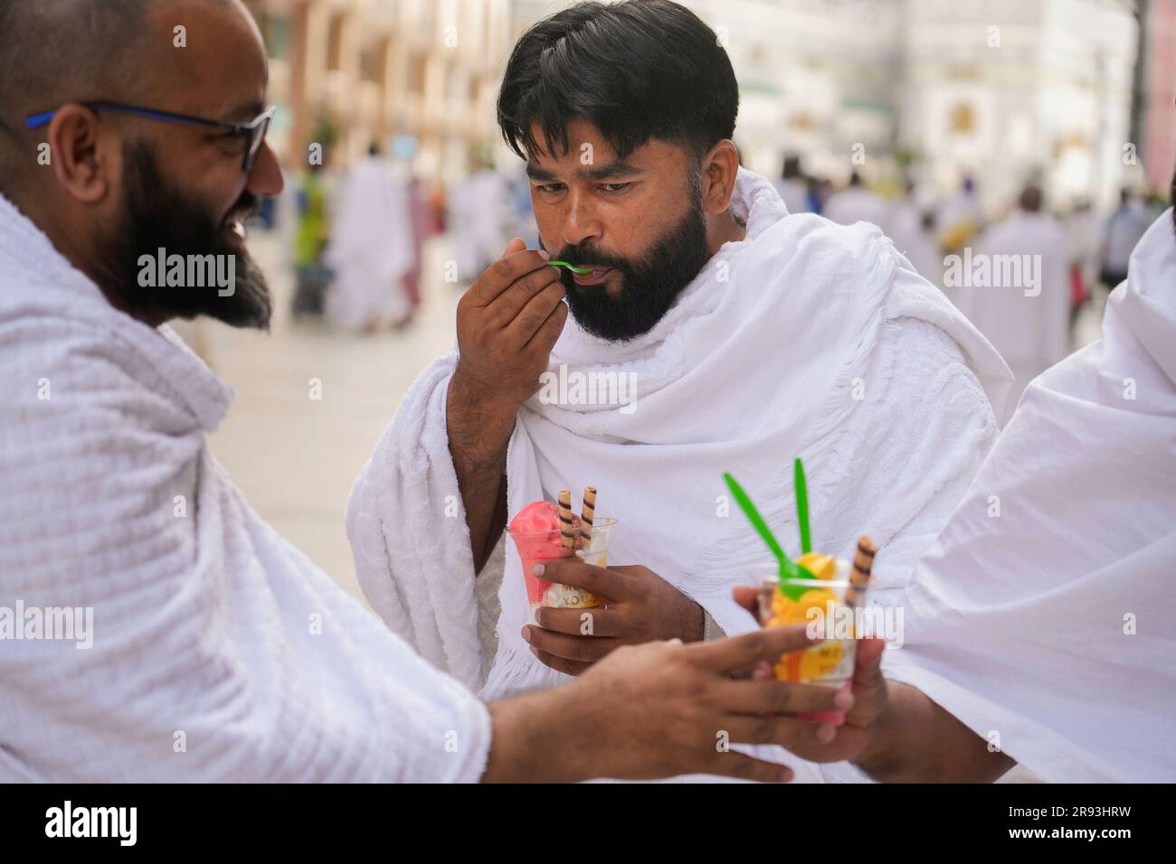 Pakistani pilgrim Muhammad Ramzan, and his friends eat ice cream ...