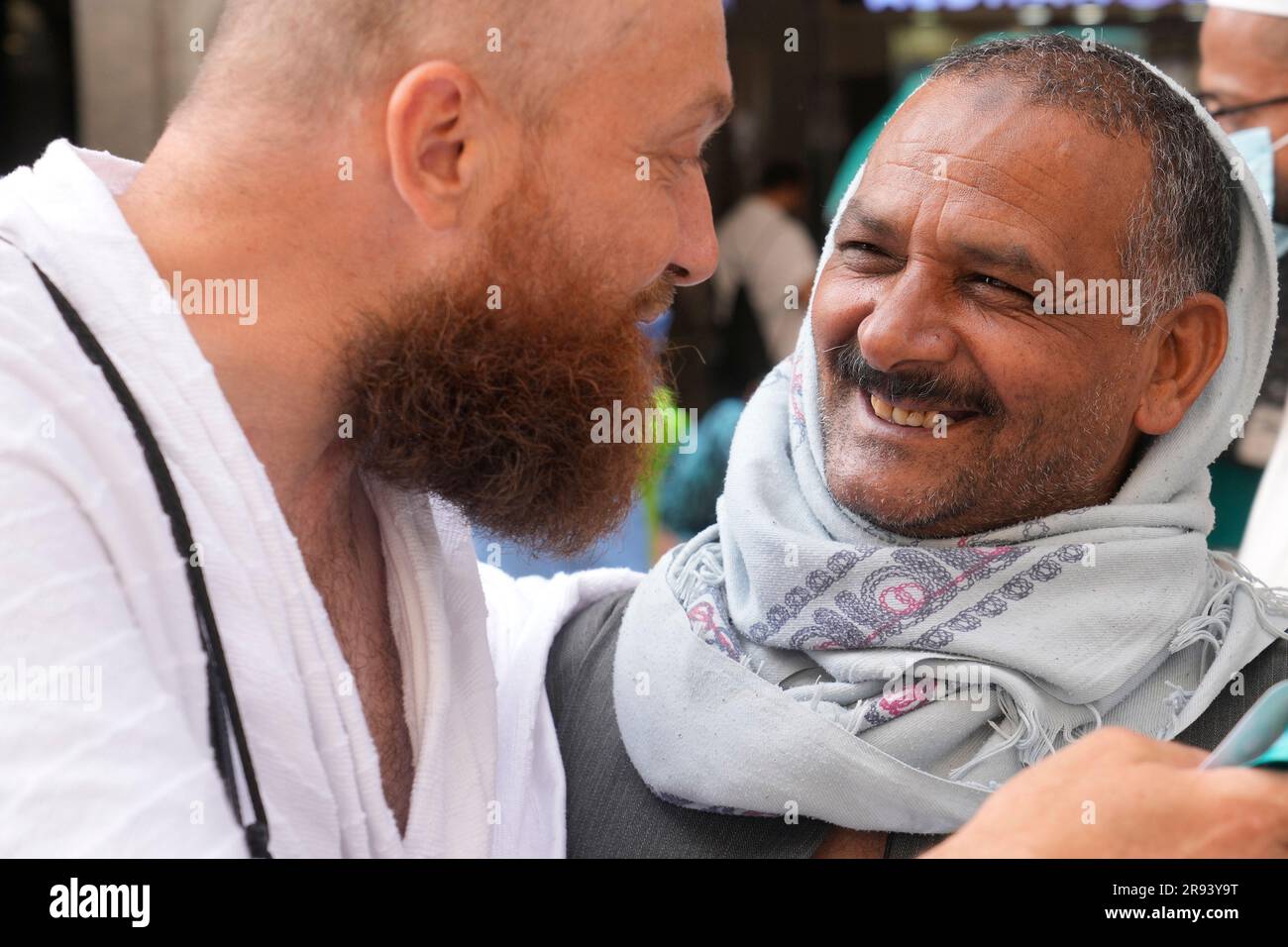 Russian pilgrim Artur Aslanov, left, chats with Egyptian pilgrim ...