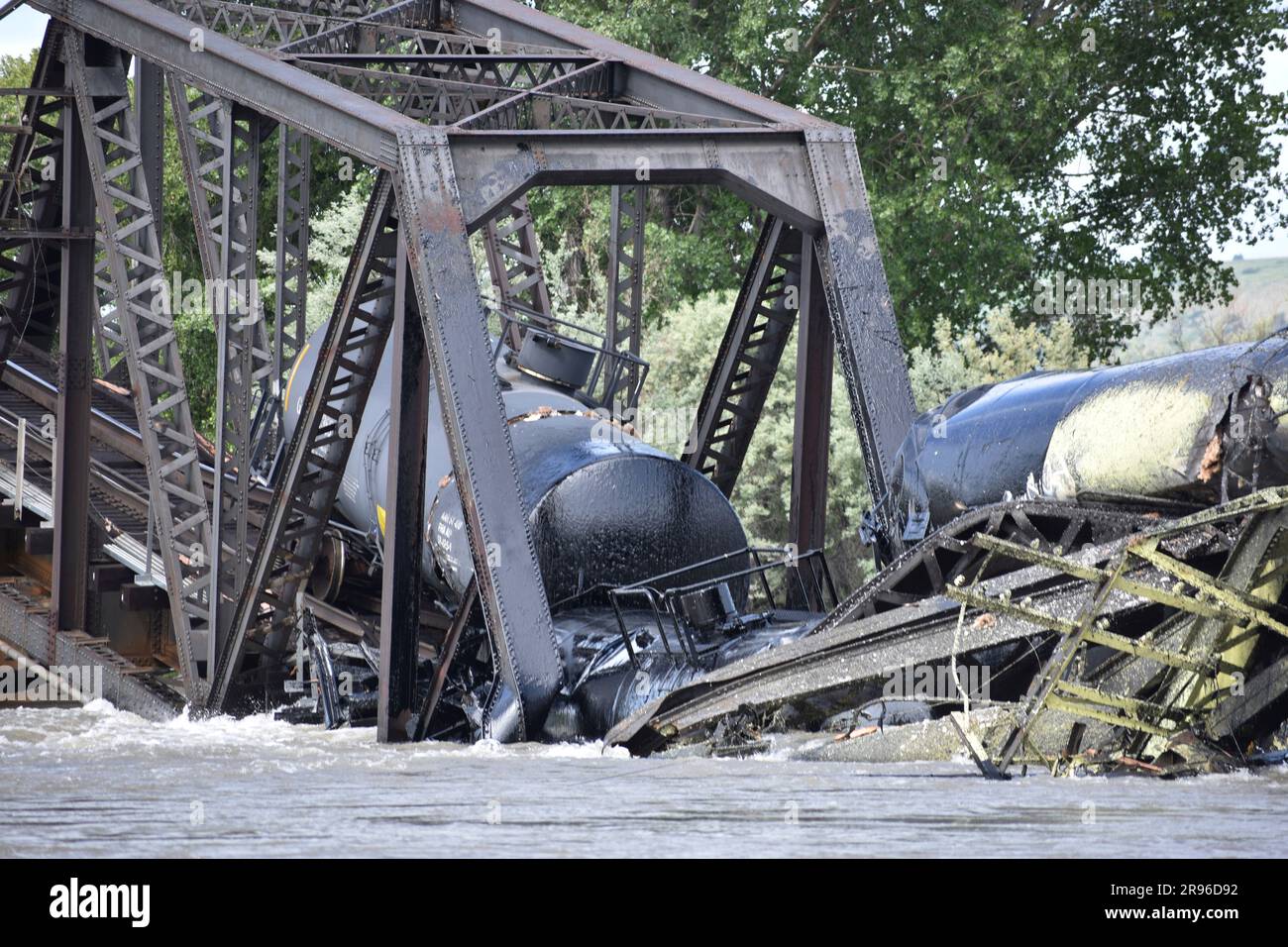 Several train cars are immersed in the Yellowstone River after a bridge ...