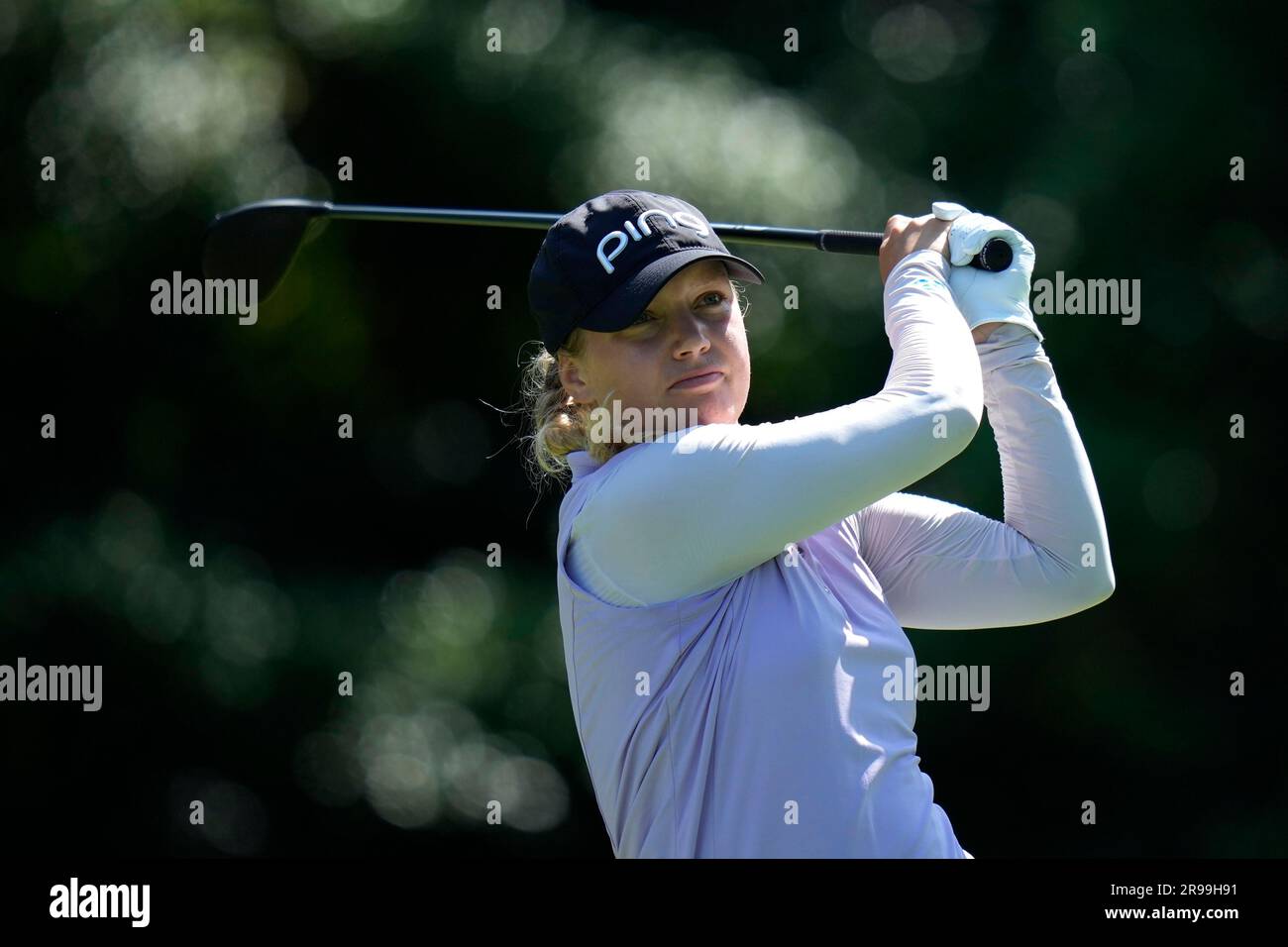 Celine Borge, of Norway, watches her shot off the tee on the second ...