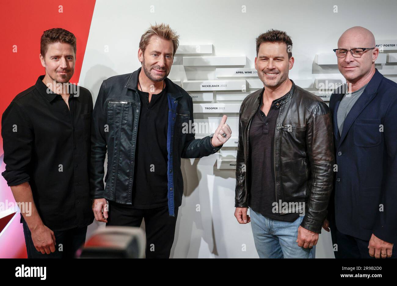 Members of the band Nickelback, consisting of, left to right, Daniel ...