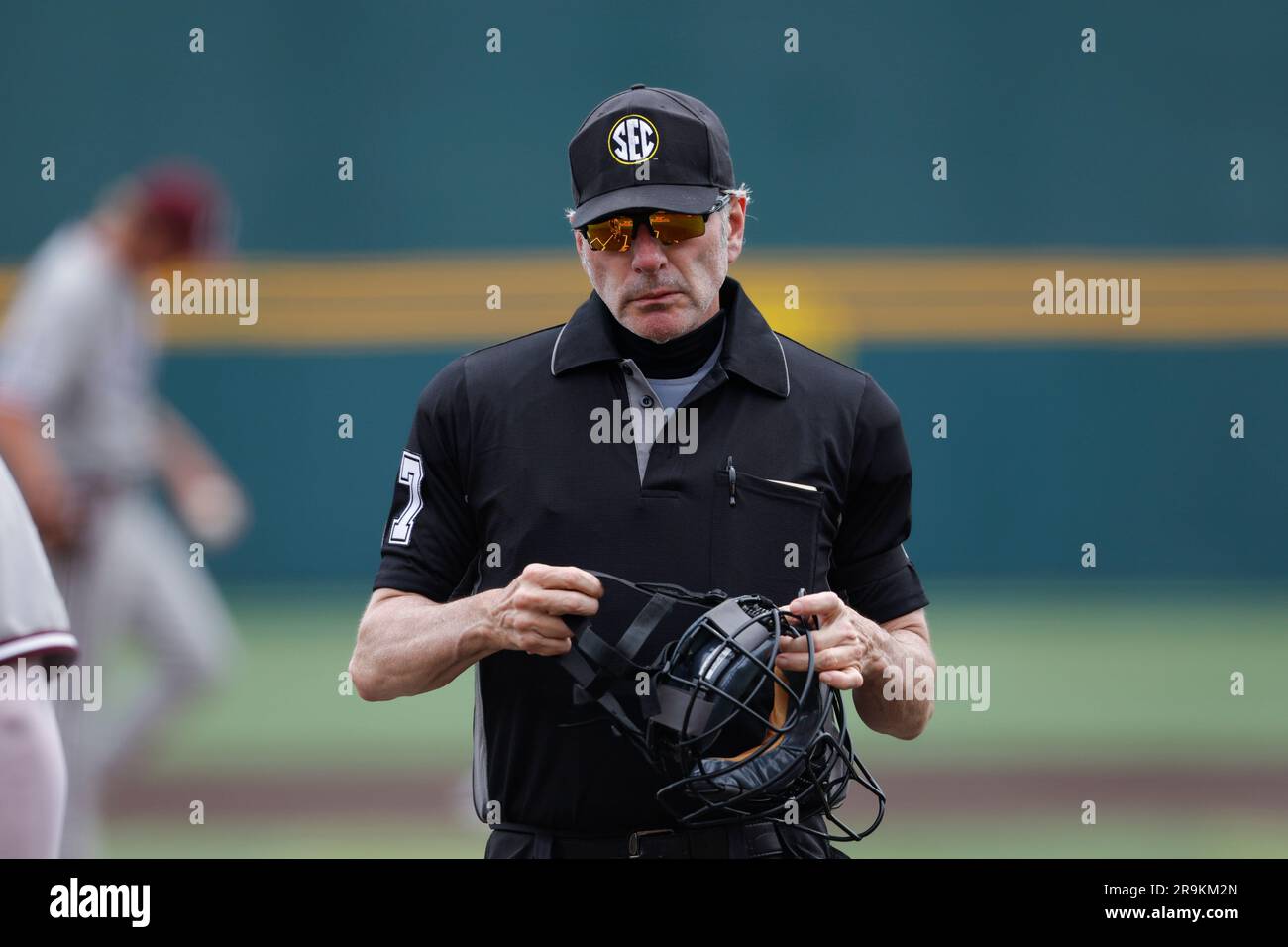 Home plate umpire Jeff Head returns to his position during the game ...