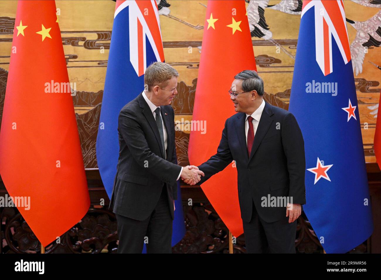 China's Premier Li Qiang, right, and New Zealand Prime Minister Chris ...