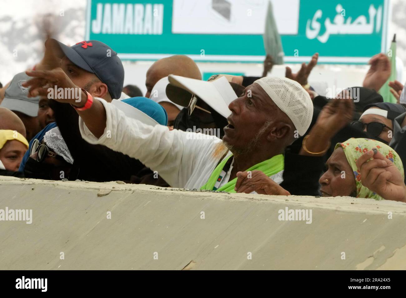 Muslim pilgrims cast stones at pillars in the symbolic stoning of the ...