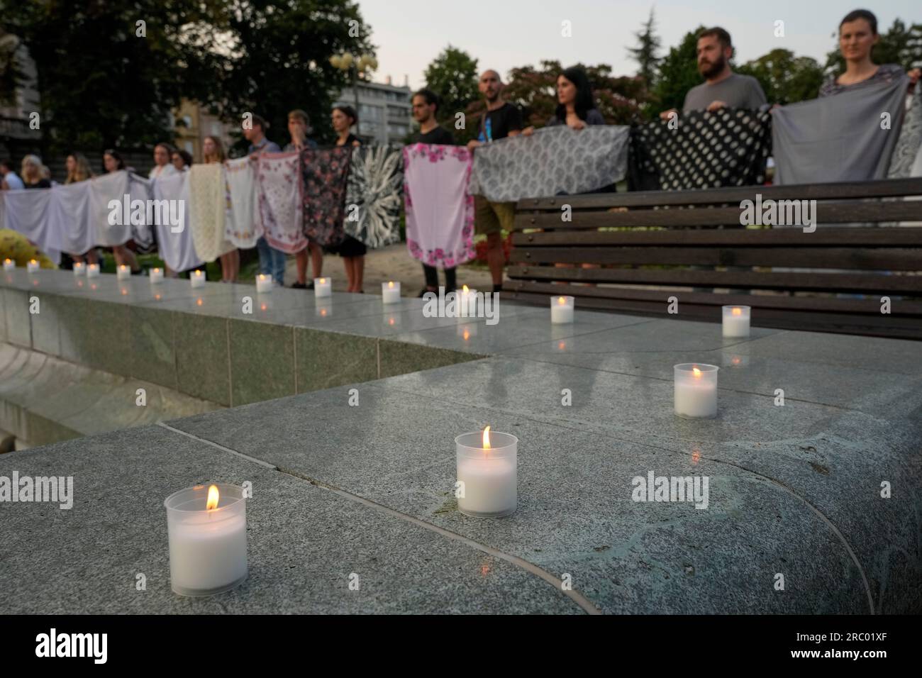 People attend a vigil to mark the 28th anniversary of the Srebrenica ...