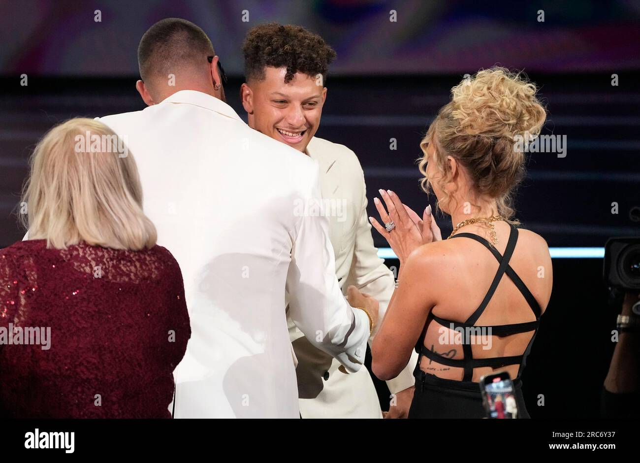 Professional NFL football player Patrick Mahomes of the Kansas City Chiefs, center, winner of ...