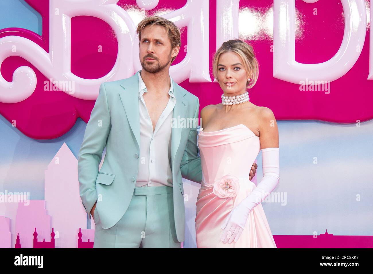 Ryan Gosling and Margot Robbie pose for photographers upon arrival at ...