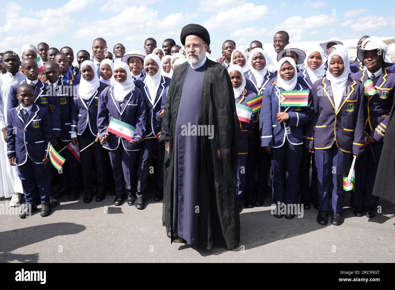 Iran's President Ebrahim Raisi poses for a photograph with children ...