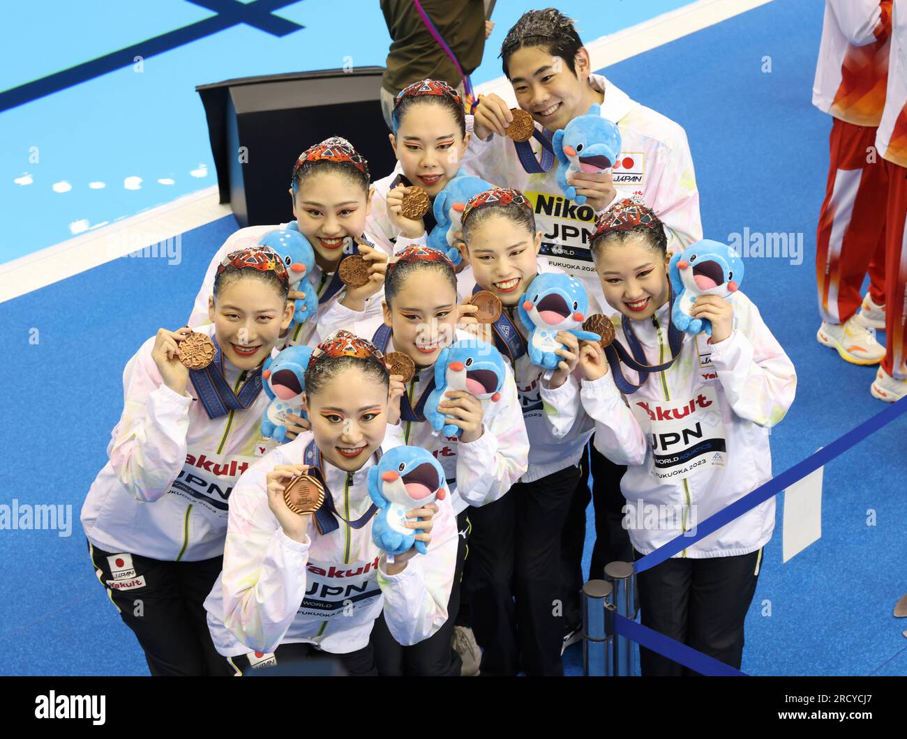 Japan team poses with their bronze medals after competing in the team ...