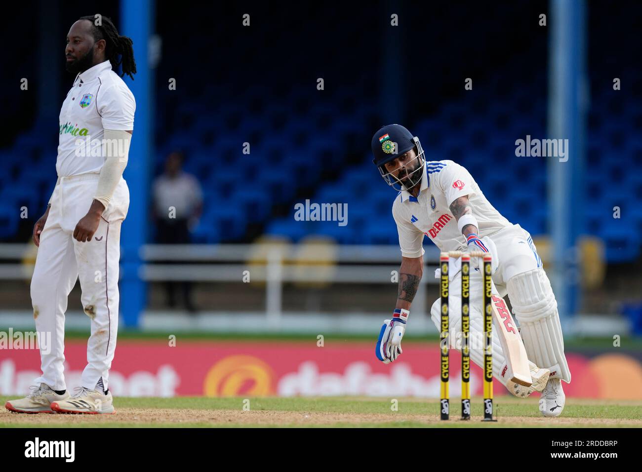 India's Virat Kohli scores runs from the bowling of West Indies' Jomel ...
