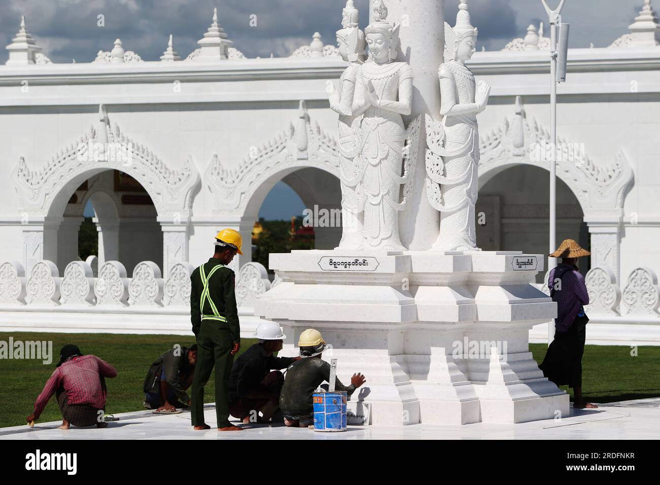 Laborers work in front of buildings in the compound of the Maravijaya ...